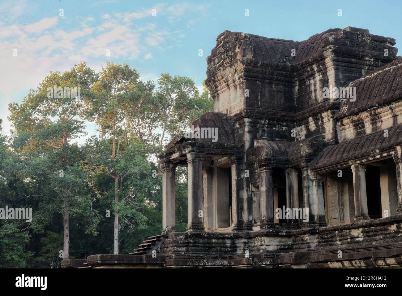 Standing amidst the ruins of Angkor, Cambodia, is an abandoned medieval ...