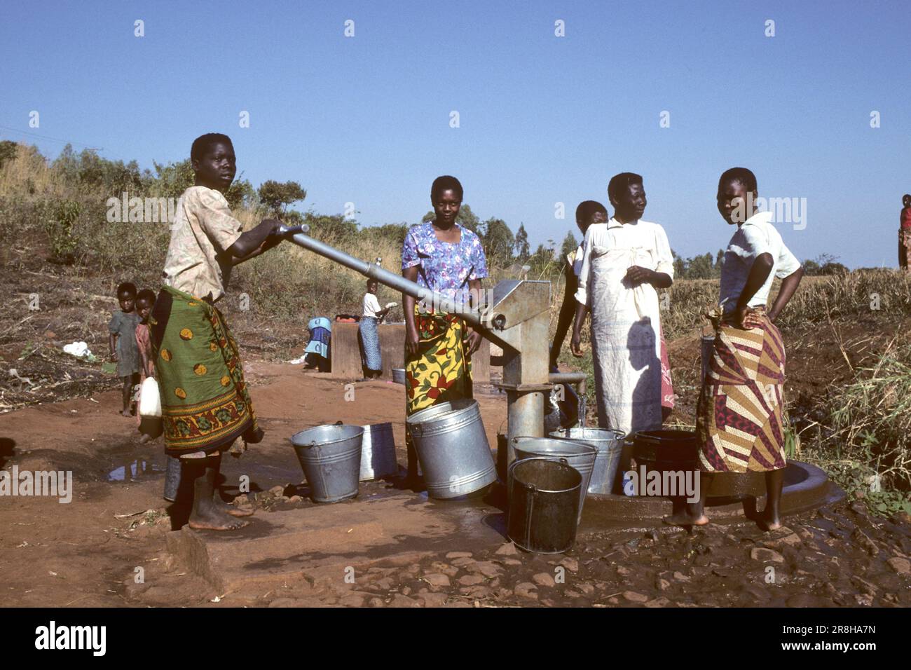 Women water well pump hi-res stock photography and images - Alamy