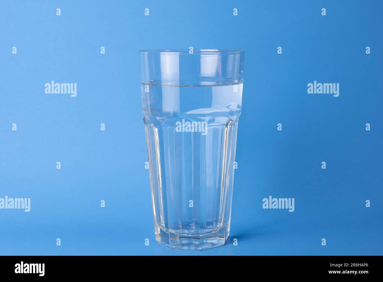 Clear glass of pure water on the blue background Stock Photo - Alamy