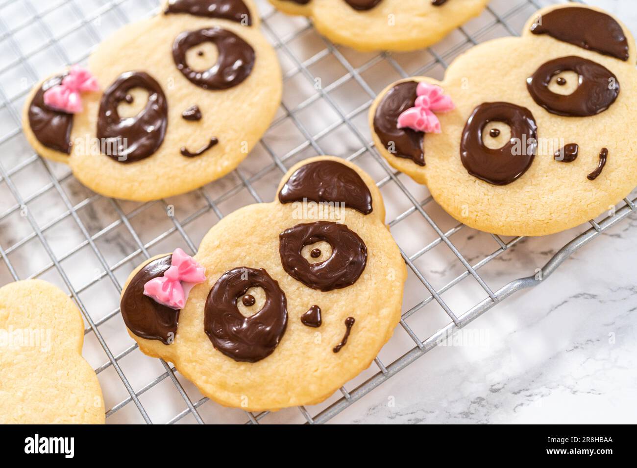 Panda shaped shortbread cookies with chocolate icing Stock Photo - Alamy