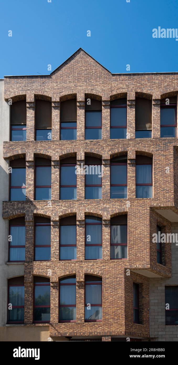 Paris, France - 05 20 2023: View of the facade of a red brick building ...