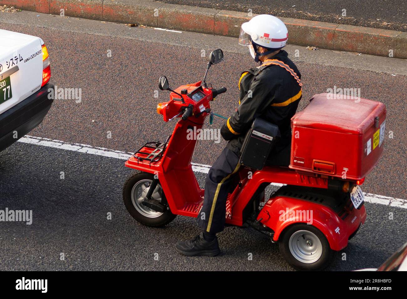 Tokyo, Japan. 3rd Mar, 2023. A postal worker for JAPAN POST (æ-¥æœ¬éƒµæ ...