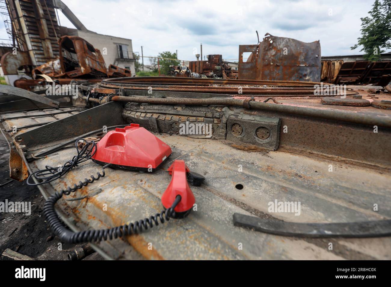 LYMAN, UKRAINE - JUNE 16, 2023 - A red corded landline telephone is ...