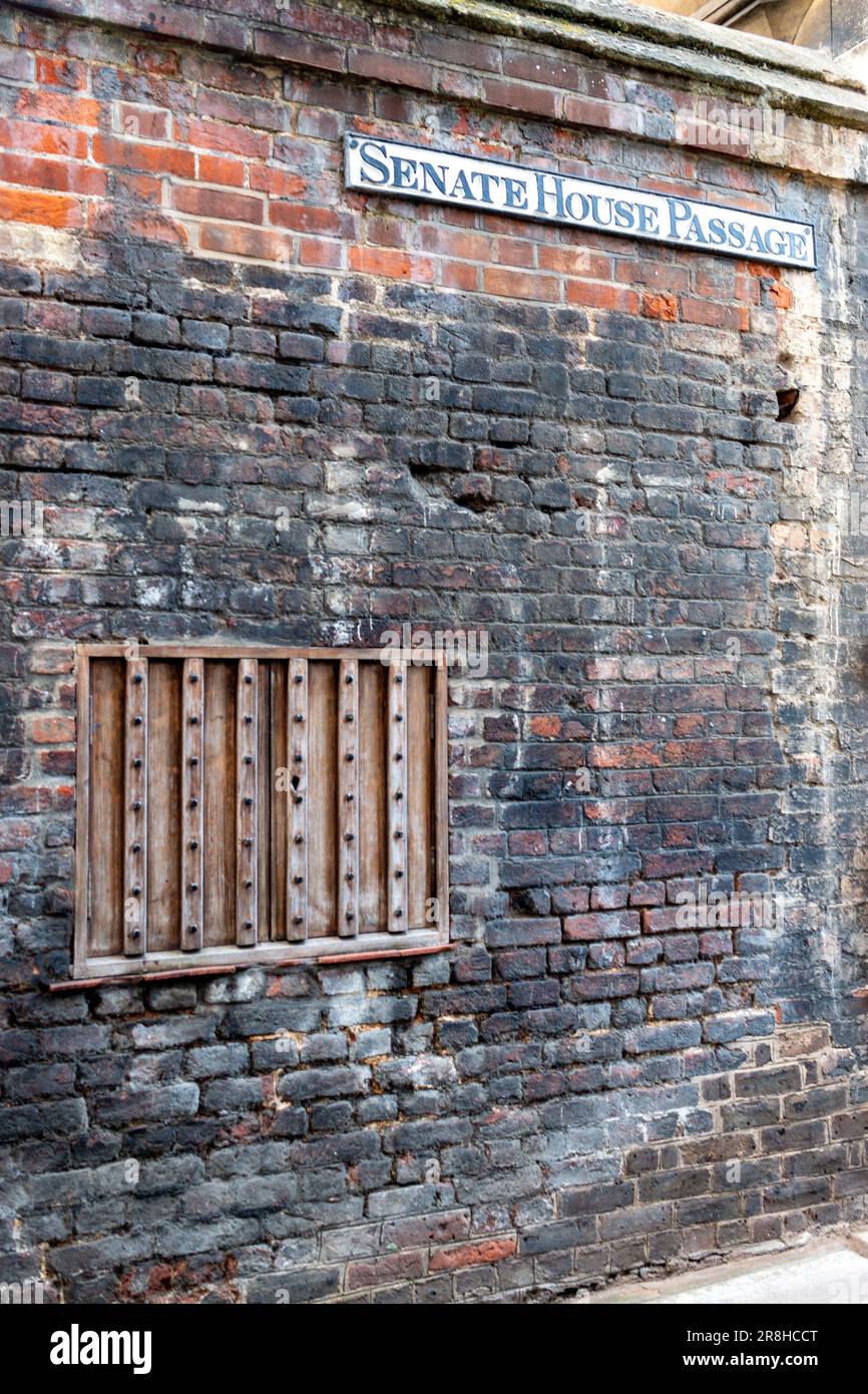 An old wooden shuttered window on the wall of Gonville and Caius ...