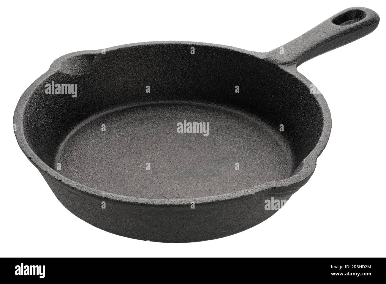 Empty round frying pan, diagonal view, close-up shot, isolated on white ...
