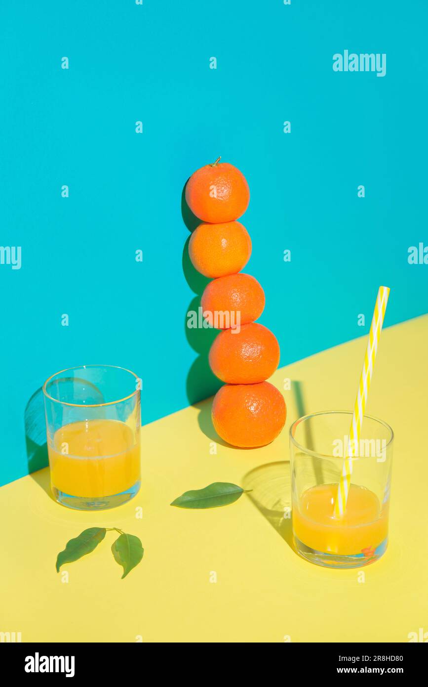 Two cocktail glasses with drinking straws. A vertical pyramid of ...