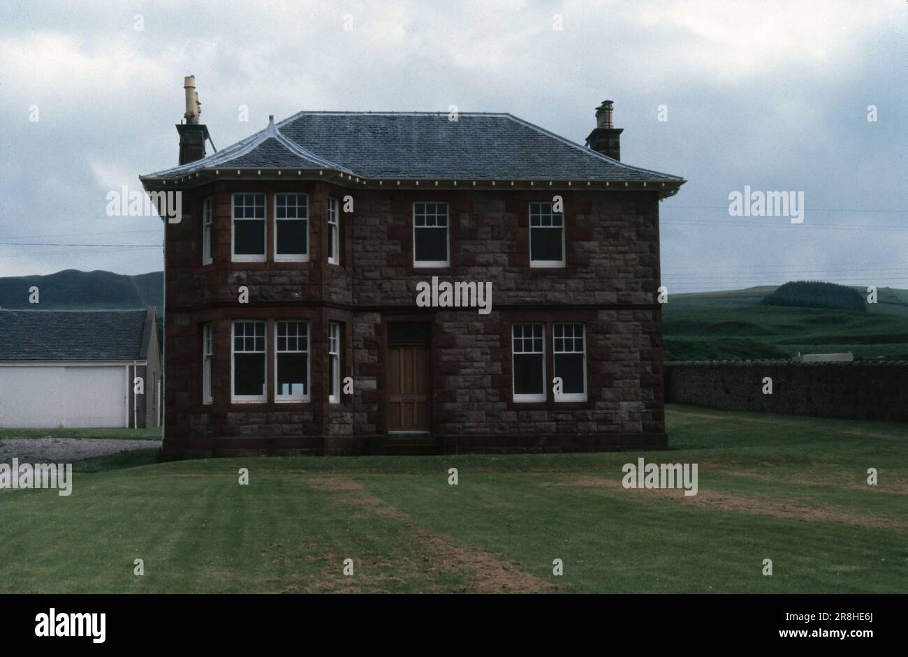 Scottish 19th century rural house, stormy and overcast summer day Stock ...