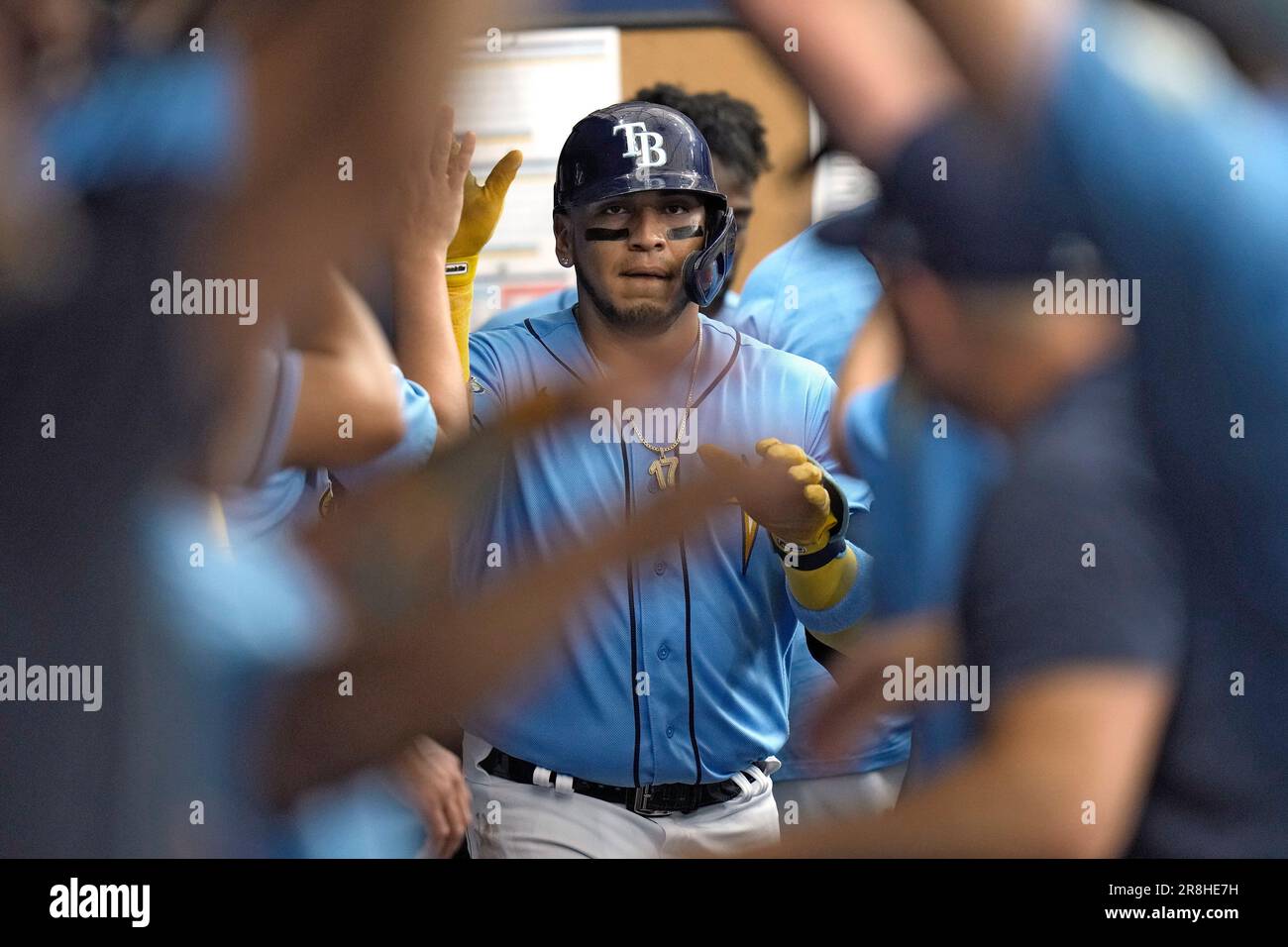 Tampa Bay Rays' Isaac Paredes celebrates in the dugout after his home ...