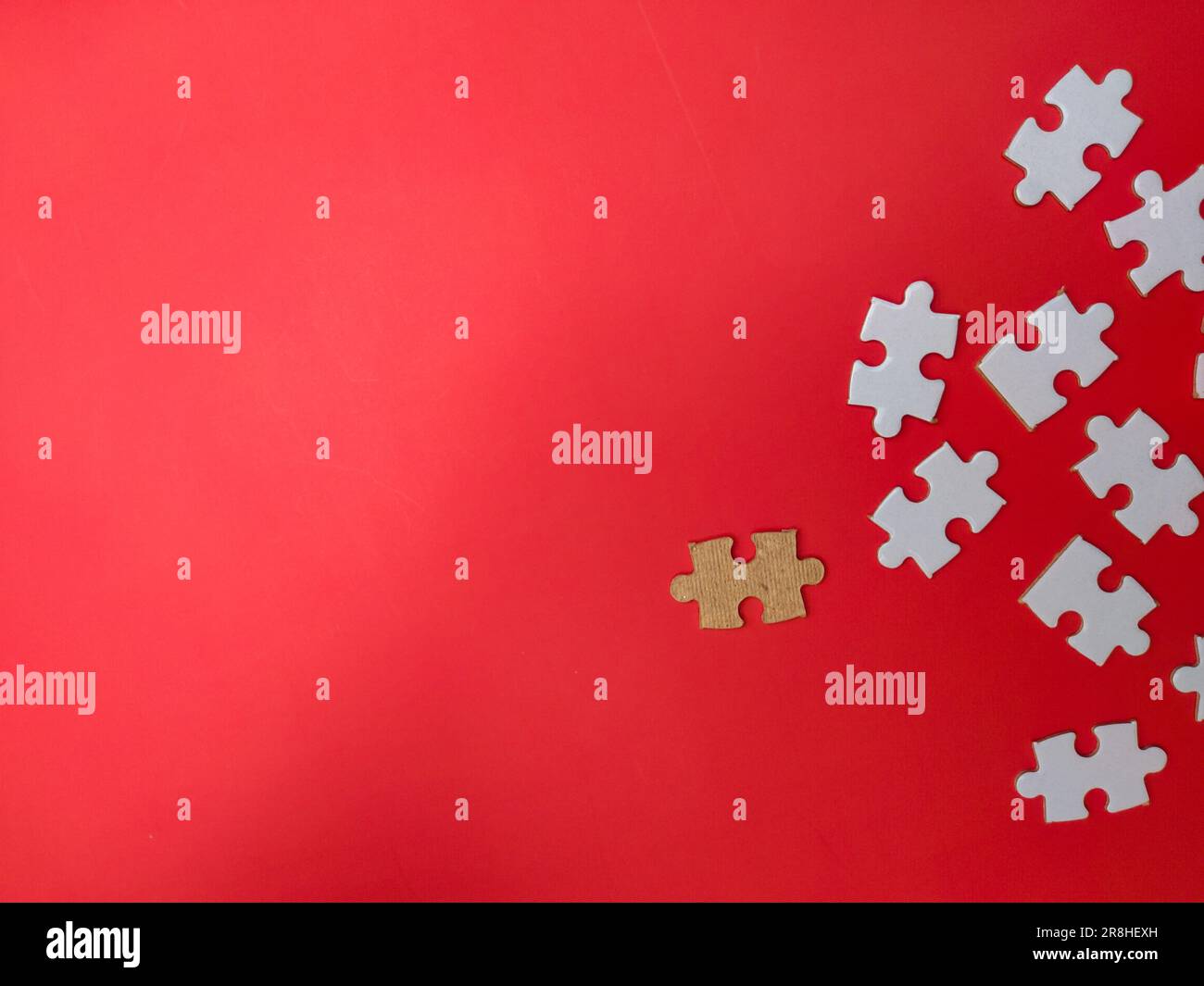 A colorful jigsaw puzzle with multiple pieces scattered across a bold ...