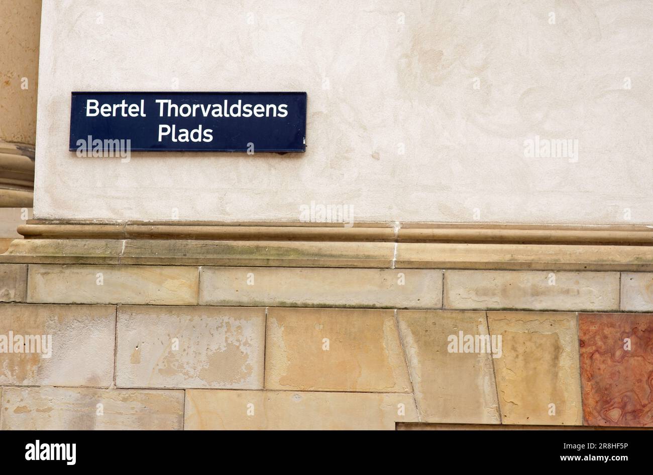 Blue street name sign of Bertel Thorvaldsens Plads on a beige stone ...