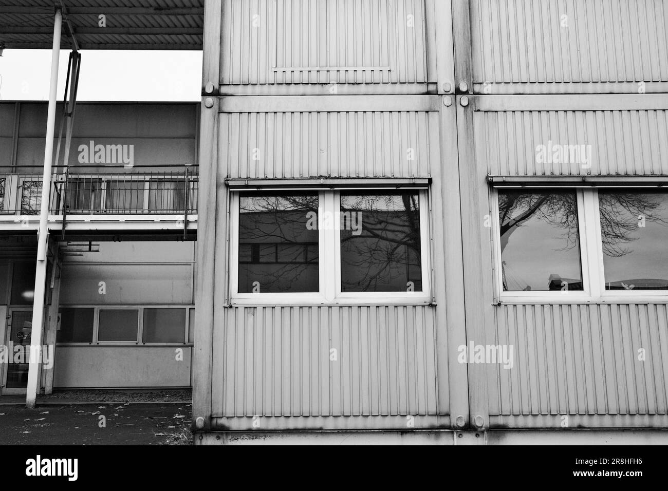 This two-story structure features expansive windows and staircases on ...