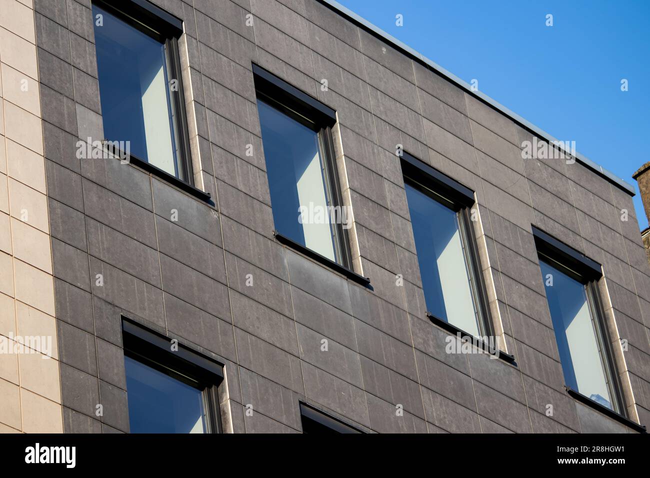 Modern freshly constructed urban building, combined steel with glass ...
