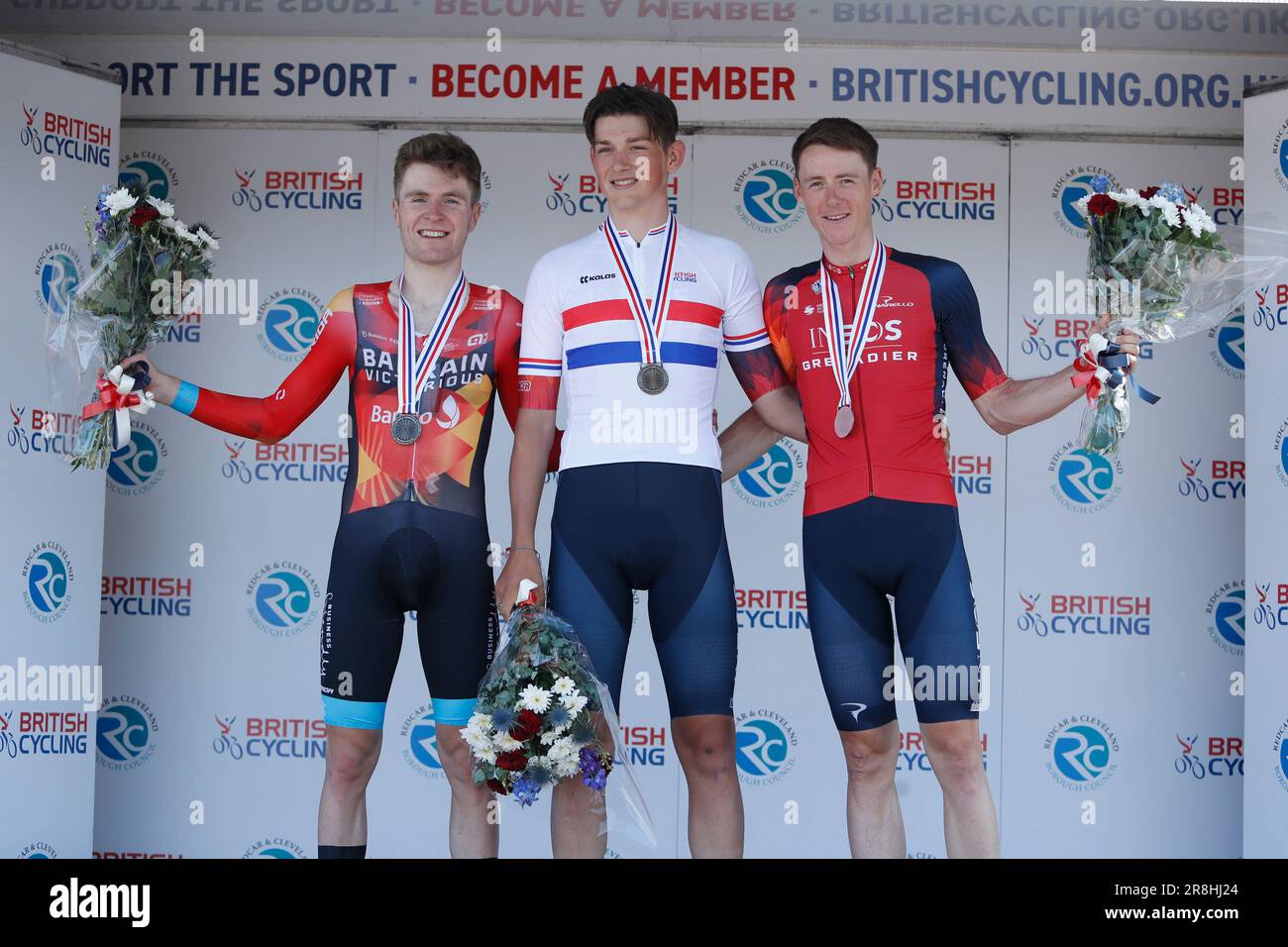 Ineos Grenadiers' Joshua Tarling (centre), Bahrain Victorious' Fred Wright (left), and Ineos ...