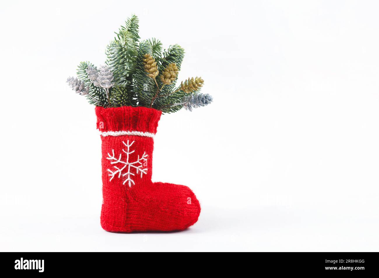 Red Christmas sock with an embroidered white snowflake and green ...