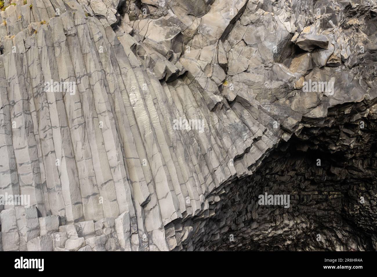 Detail of a mountain with a cave, located on a beach. Fascinating ...