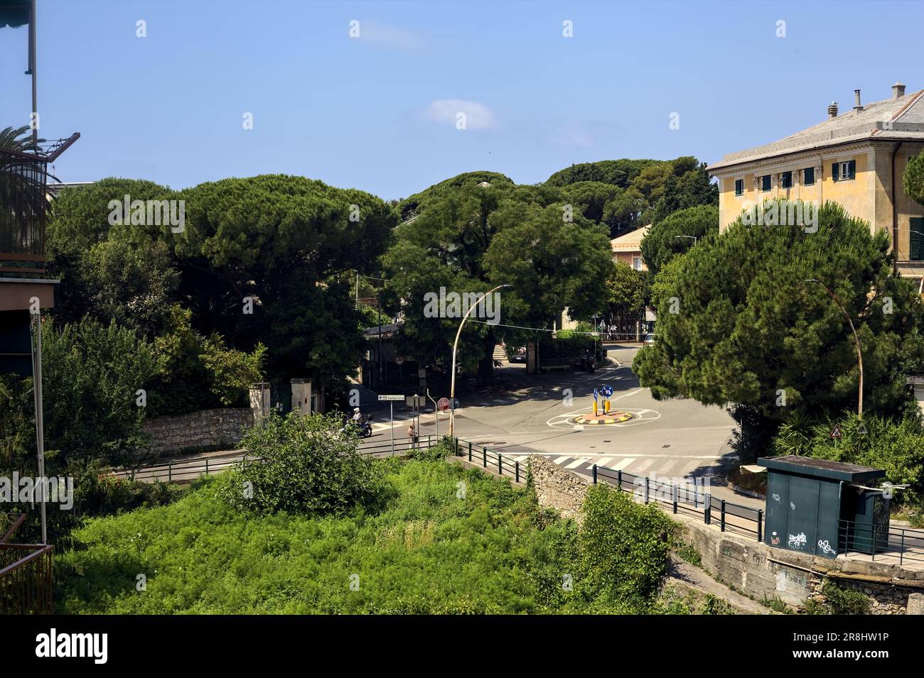 Roundabout next to a park and an elevated road seen from above in an ...