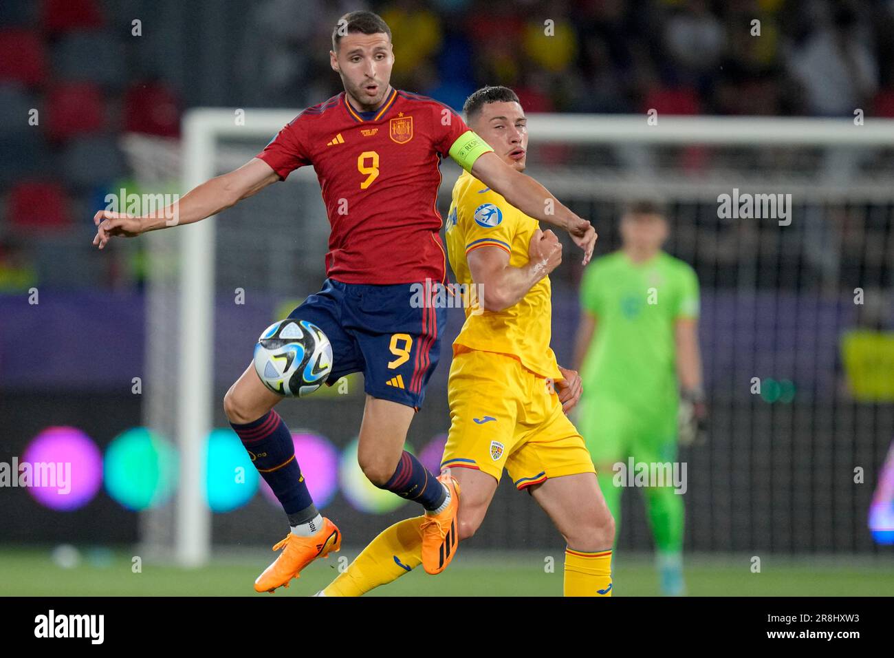 Abel Ruiz of Spain challenges for the ball with Bogdan Racovitan of ...