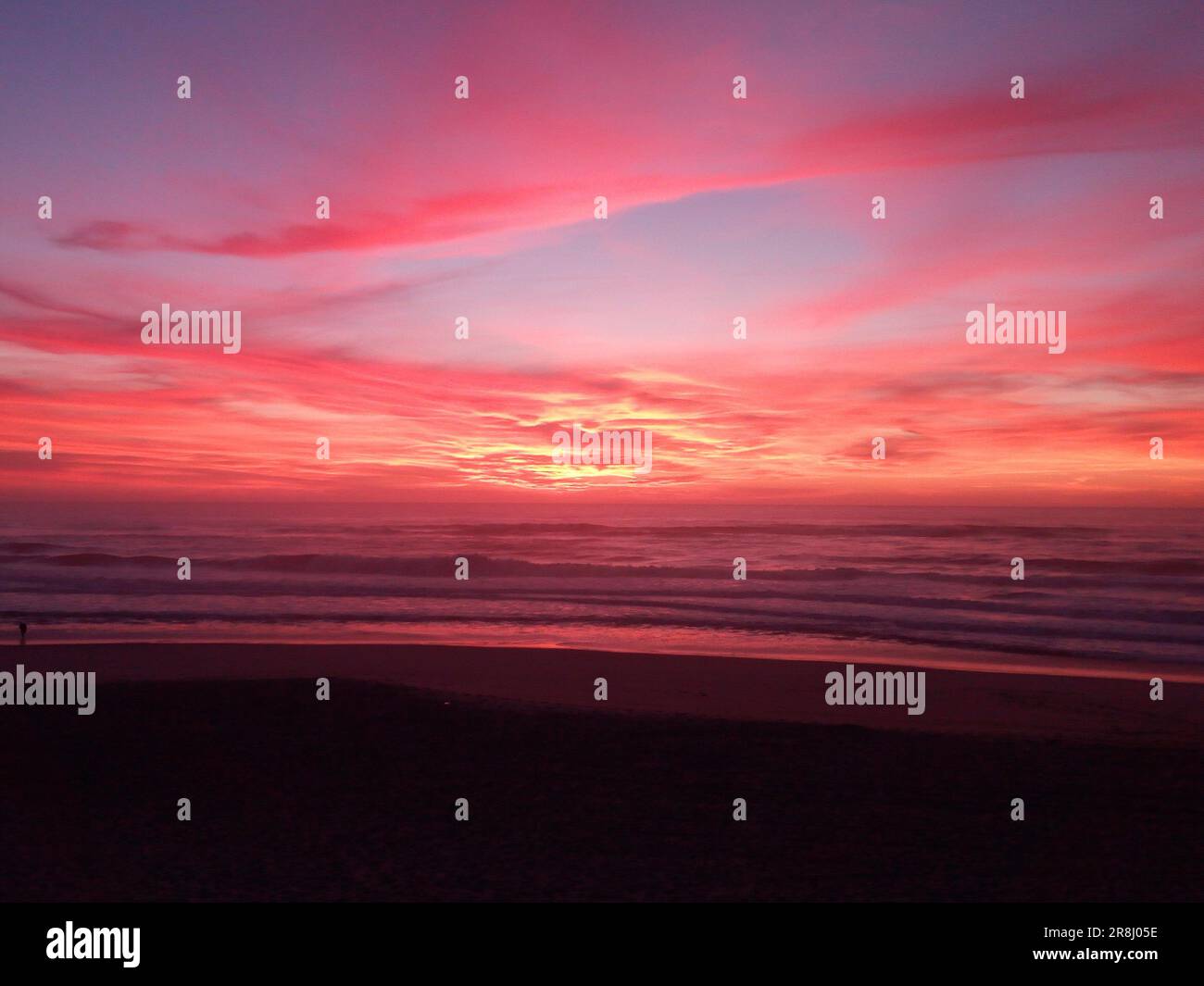 A stunning sunset over the horizon of the ocean is captured in this ...