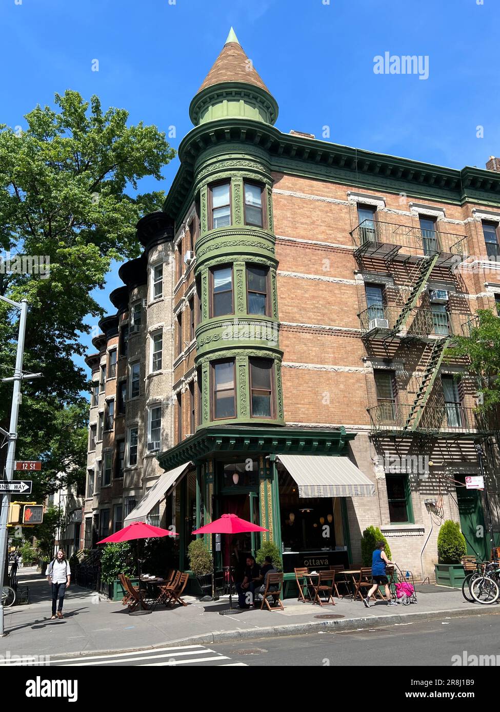 Classic apartment building with a restaurant on the corner of 12th ...