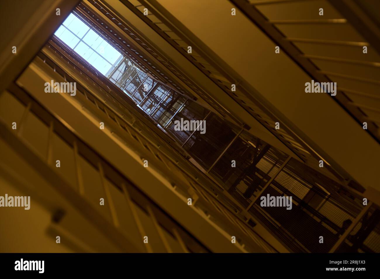 Stairwell and elevator in a residential building with a window on the ...