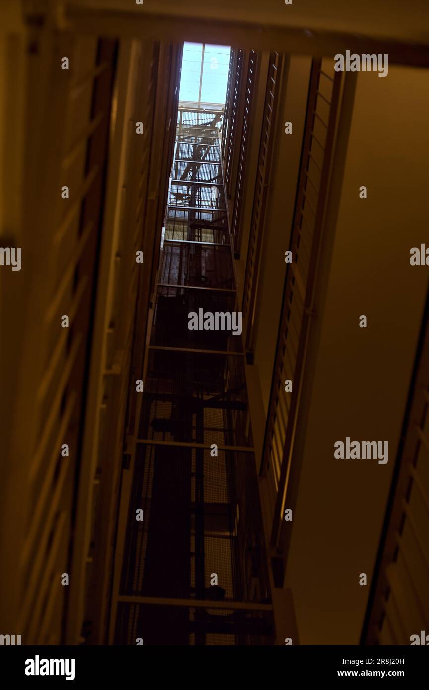 Stairwell and elevator in a residential building with a window on the ...