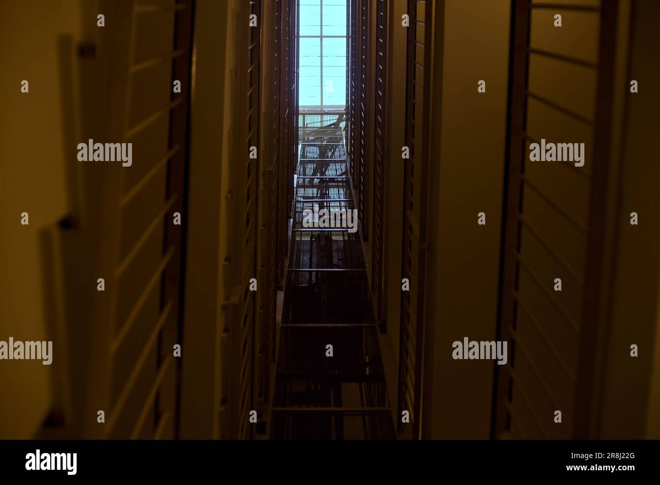 Stairwell and elevator in a residential building with a window on the ...