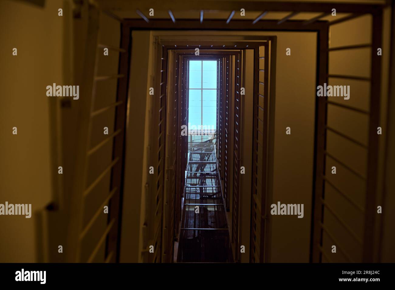 Stairwell and elevator in a residential building with a window on the ...