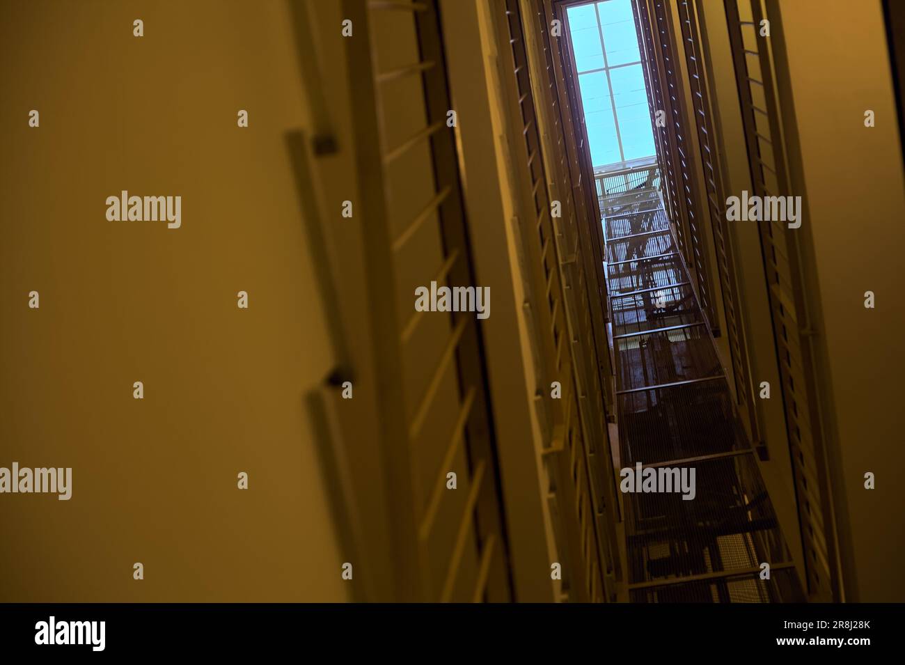 Stairwell and elevator in a residential building with a window on the ...