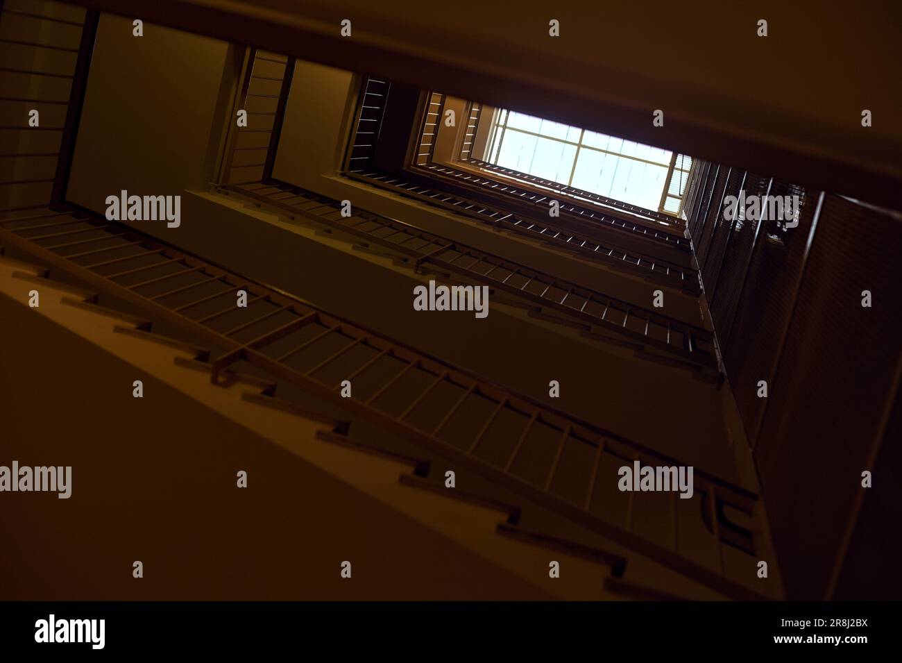 Stairwell and elevator in a residential building with a window on the ...
