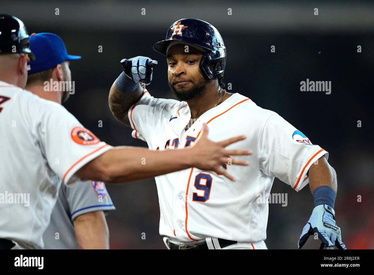Houston Astros' Corey Julks (9) celebrates with first base coach Omar ...