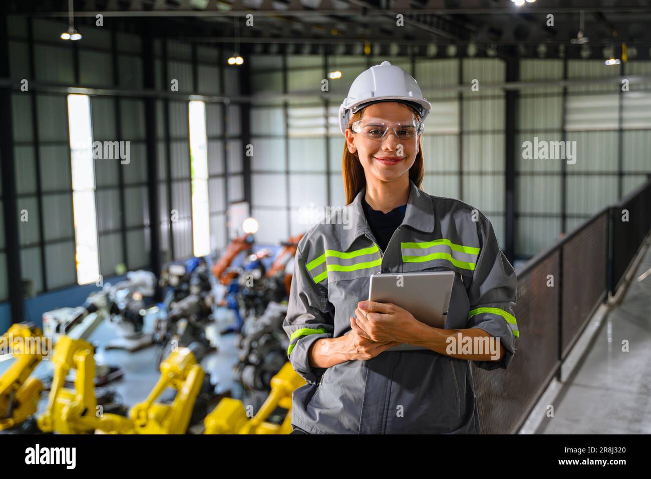 Female engineer worker working with robotic machine automation Stock ...