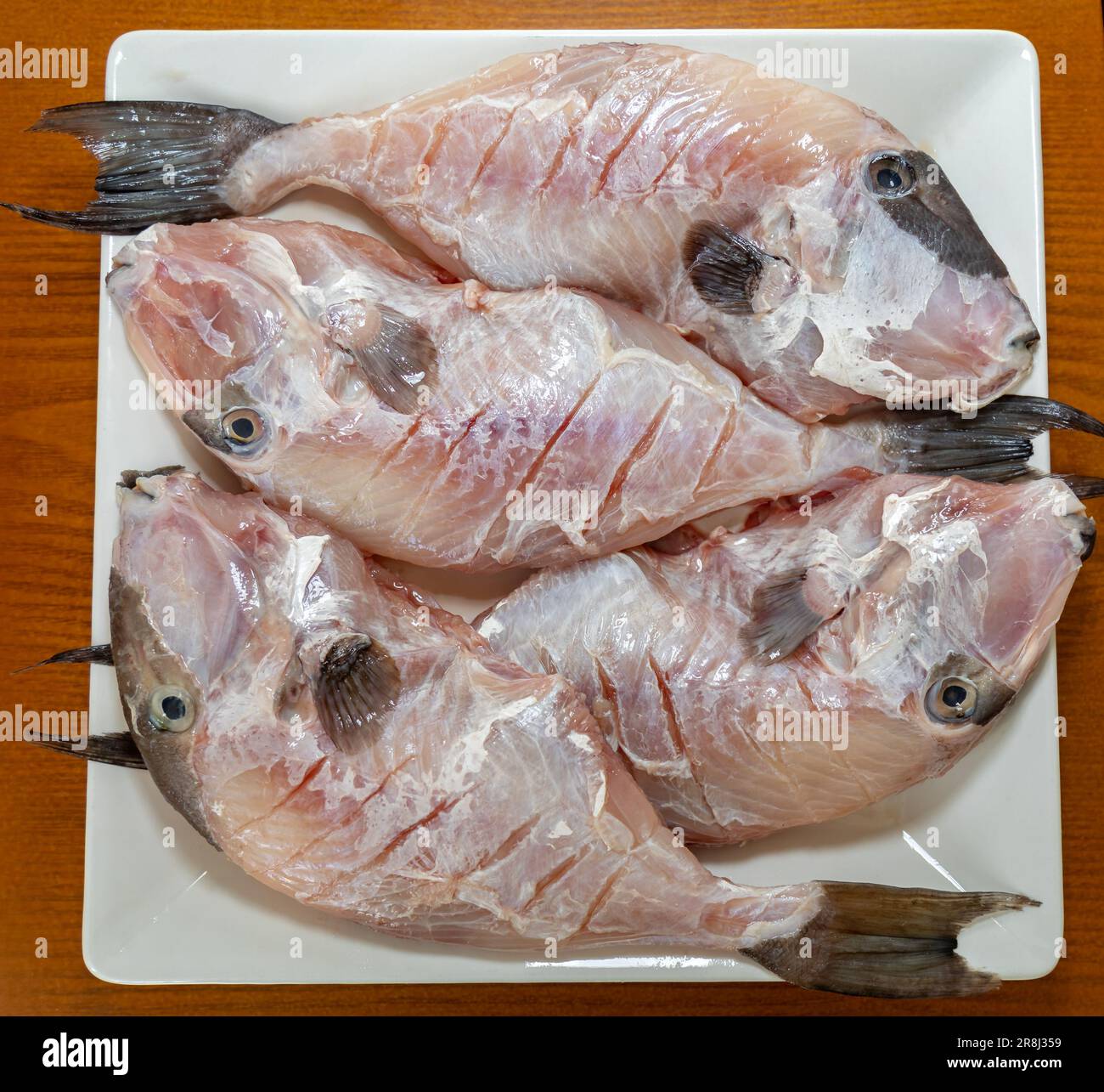 Clean and seasoned Peroá fish (Balistes capriscus) . Typical fish from ...