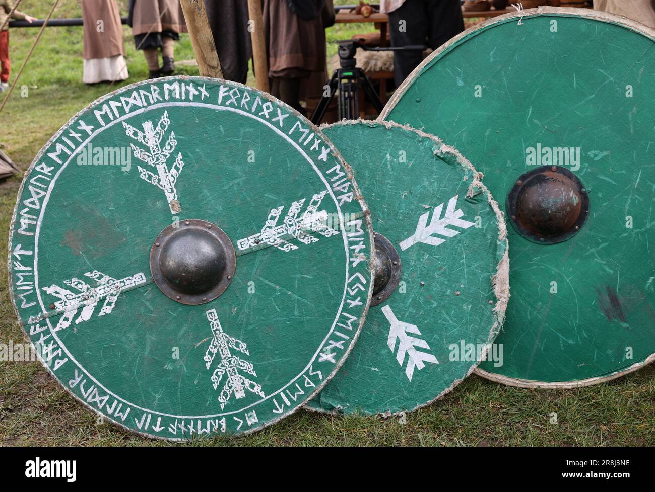 Medieval weapons, shields in knight camp at the festival of historical ...