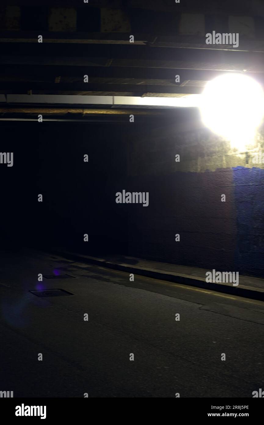 Underpass and pavement in an italian city at night Stock Photo - Alamy