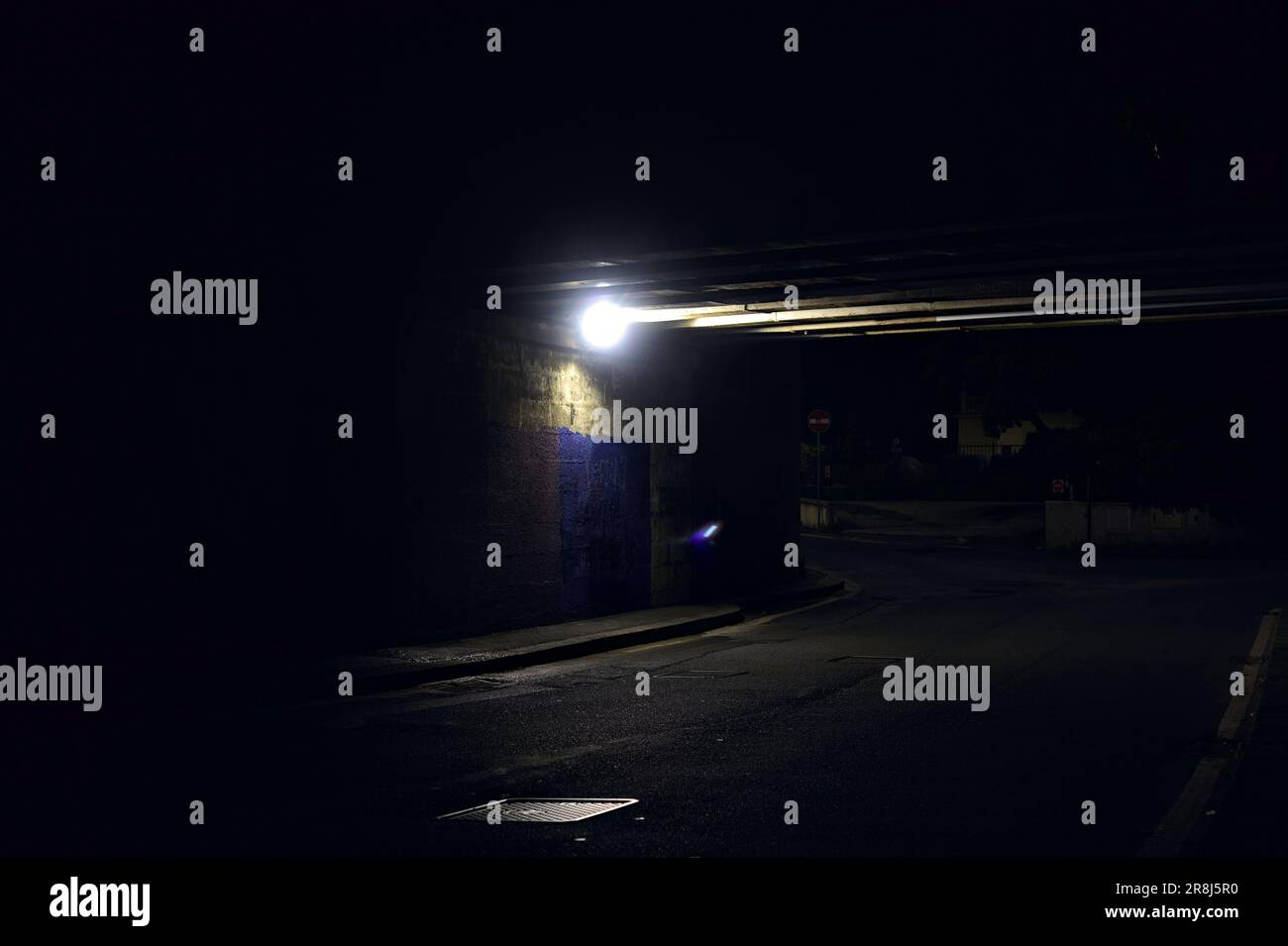 Underpass and pavement in an italian city at night Stock Photo - Alamy