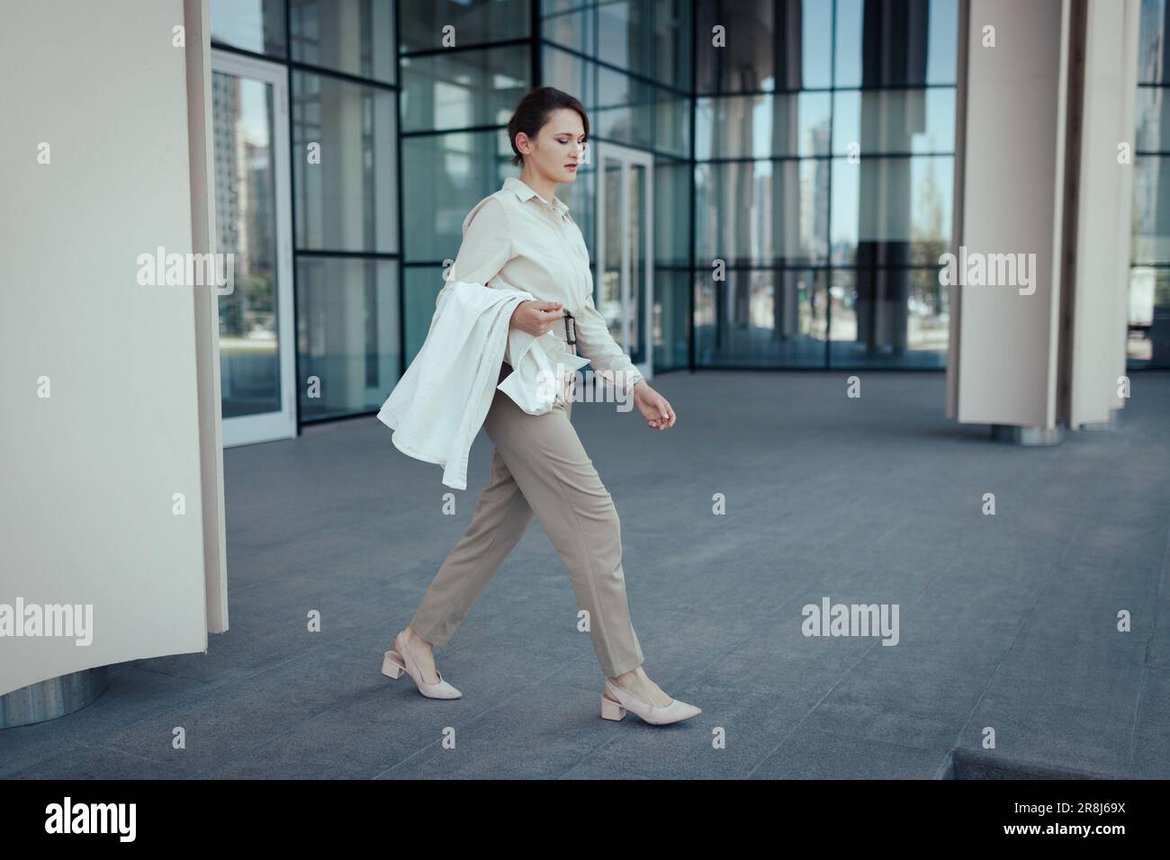 Active lifestyle of caucasian career business woman walking from work ...