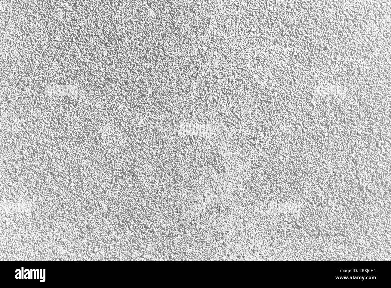 White gray uniform background of decorative textured plaster on the ...