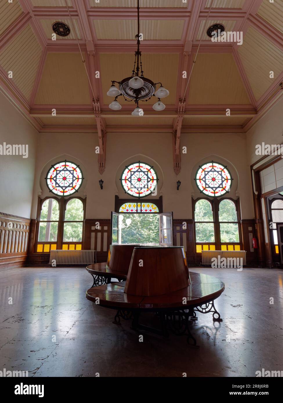 Elegant waiting room inside Sirkeci Train Station with a wooden curved ...