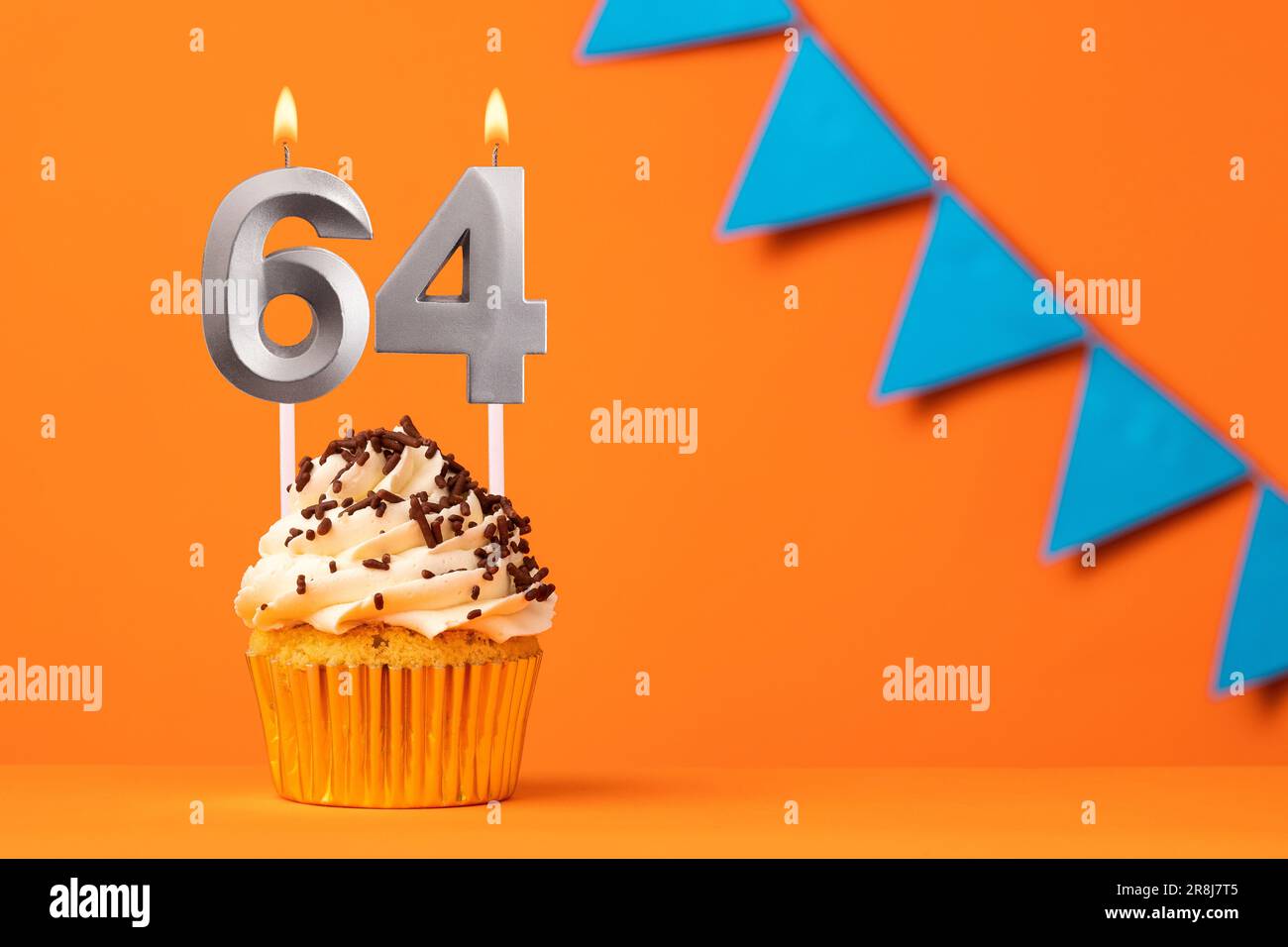 Birthday cake with candle number 64 - Orange background Stock Photo - Alamy