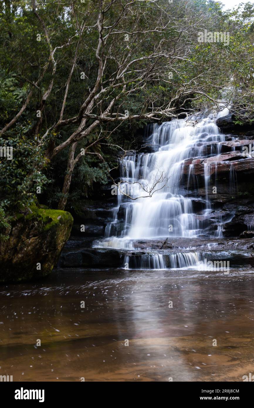 A beautiful cascading waterfall with sparkling water flowing down a ...