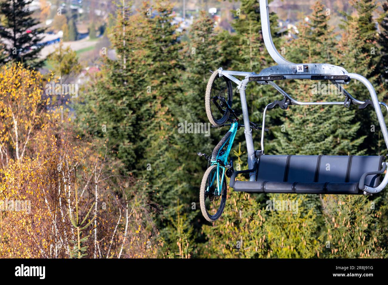 Downhill bicycle on a chairlift. Transportation of downhill bikes to ...