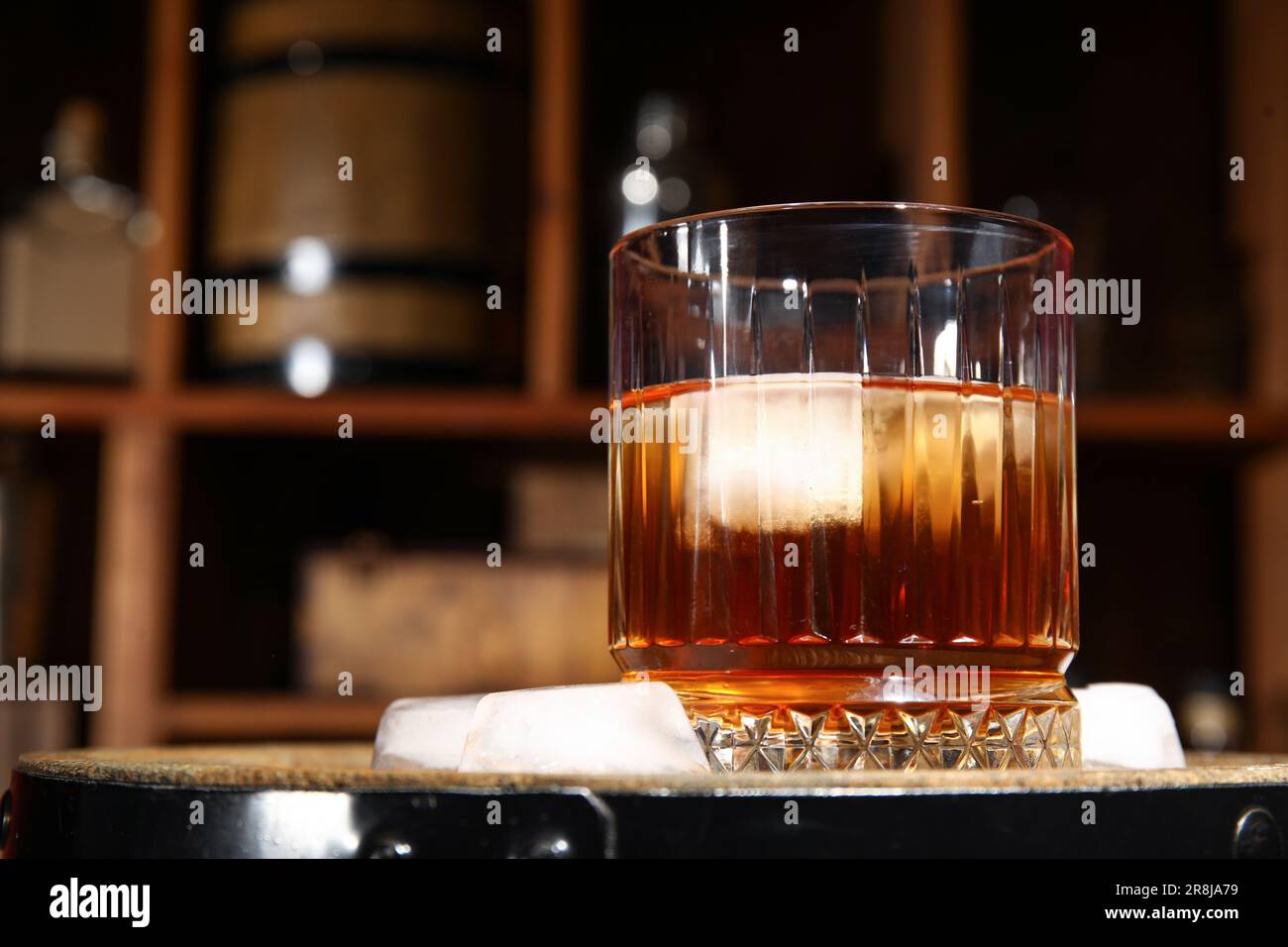 Glass of cold rum on wooden barrel in storage Stock Photo - Alamy