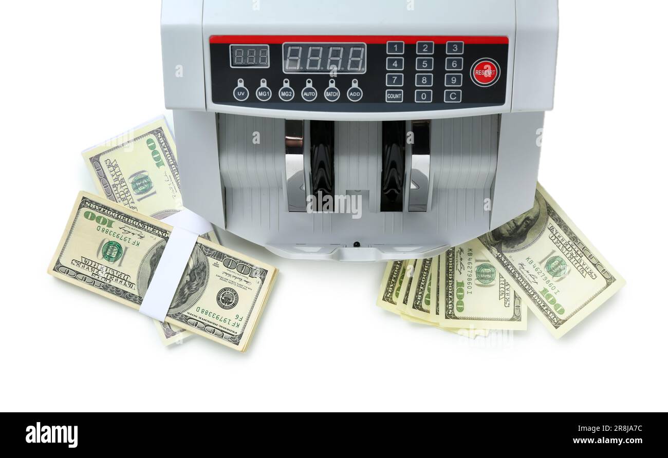 Modern cash counting machine with dollar banknotes on white background ...