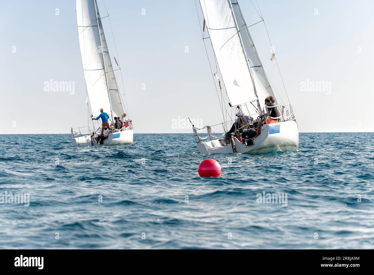 Yachts in light wind during regatta competition in open sea Stock Photo ...