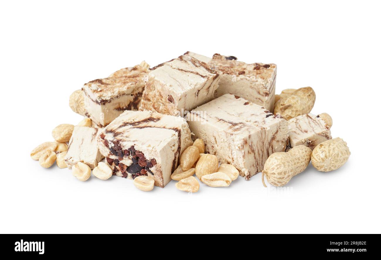 Pieces of tasty marble halva with peanuts on white background Stock Photo - Alamy