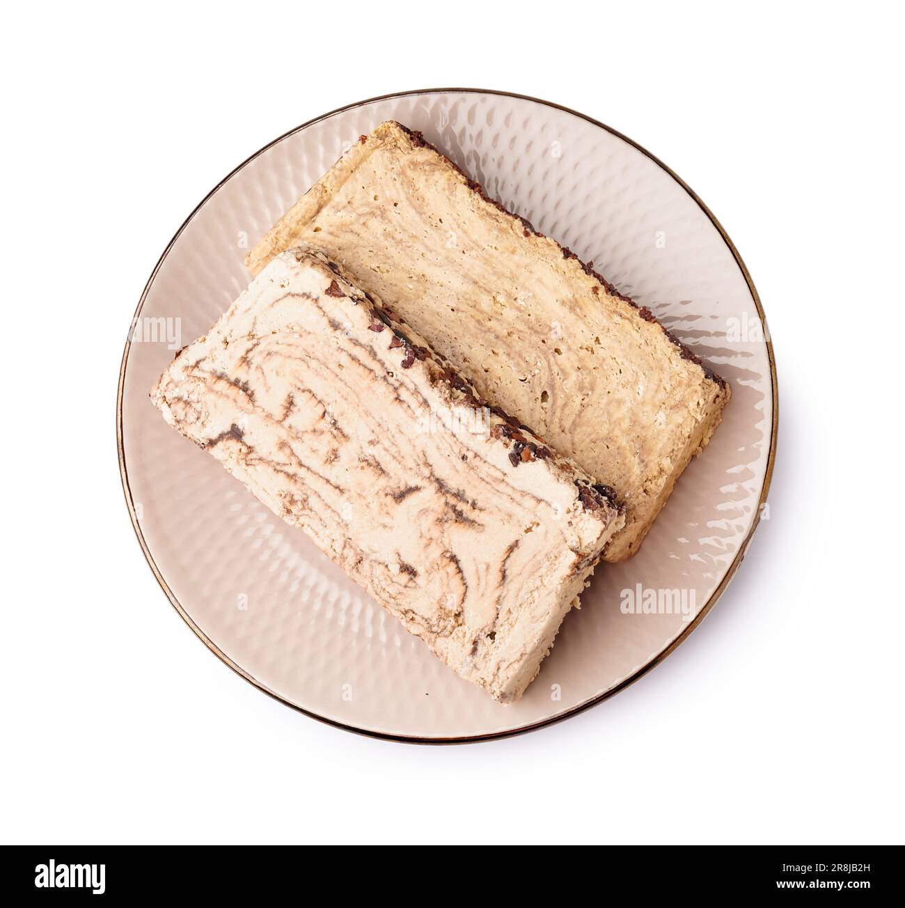 Plate with pieces of tasty marble halva on white background Stock Photo - Alamy