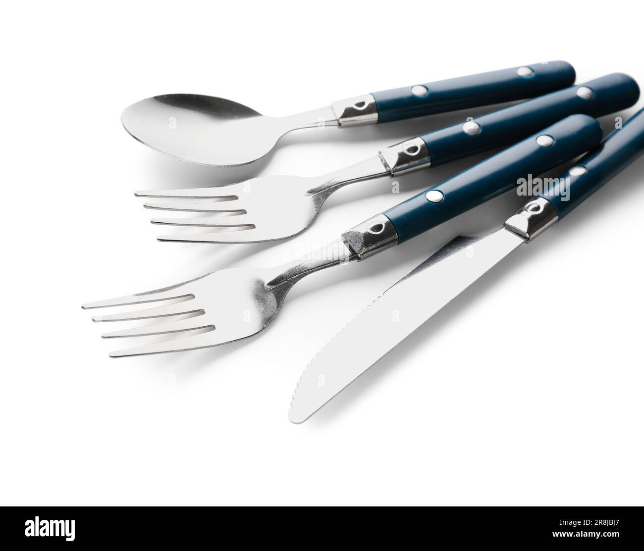 Stainless steel cutlery with blue handles on white background Stock ...