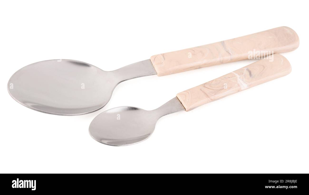 Stainless steel spoons with plastic handles on white background Stock ...