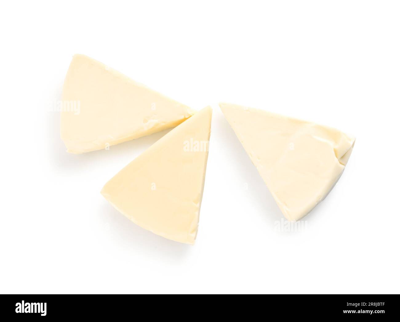 Triangles of tasty processed cheese on white background Stock Photo - Alamy