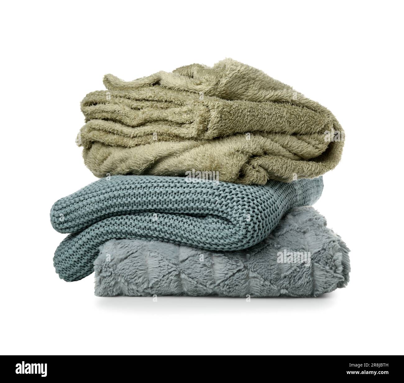 Different soft folded blankets on white background Stock Photo - Alamy